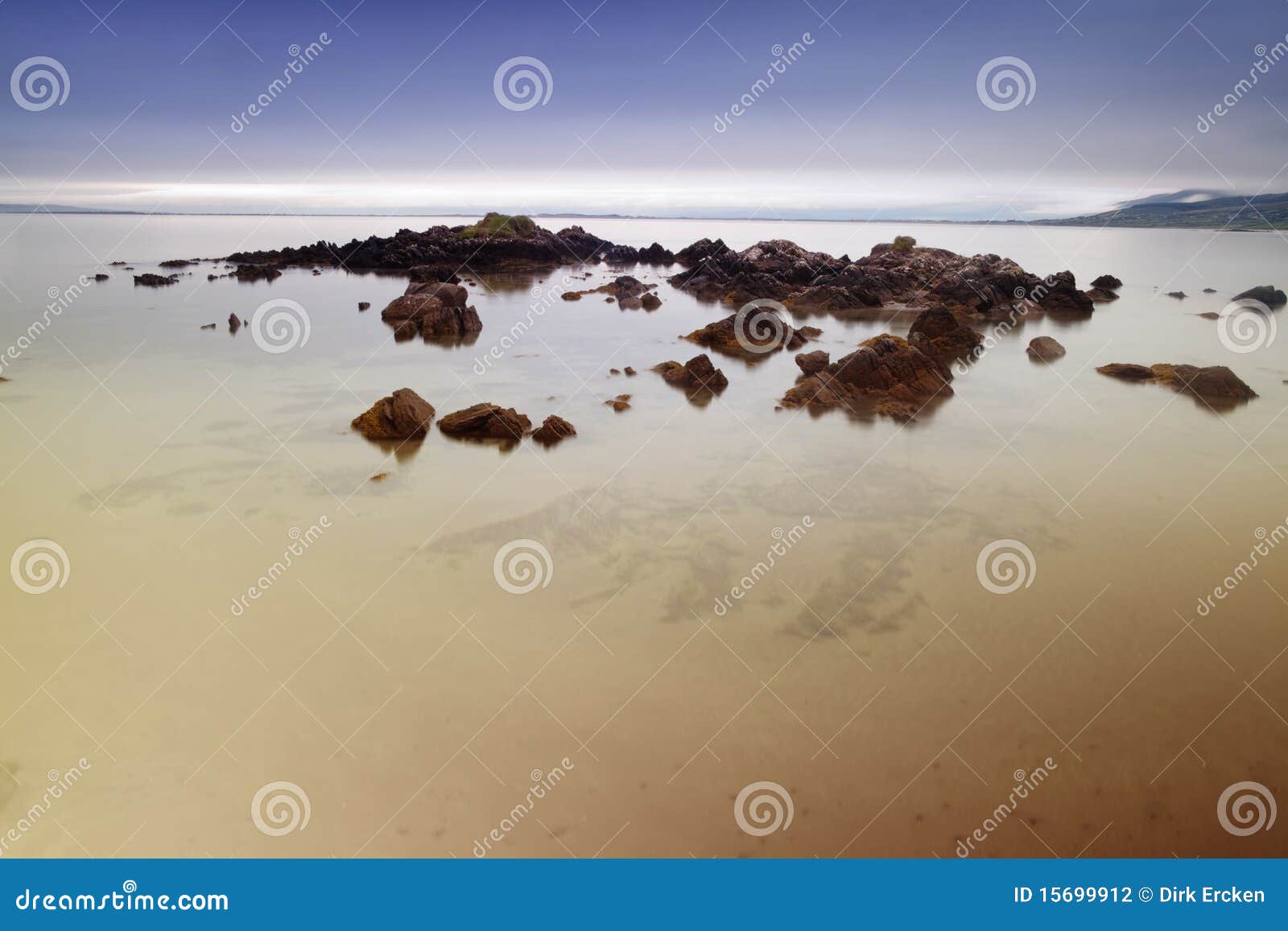 Rocks on Sandy Beach in Smooth Calm Sea Stock Photo - Image of ...