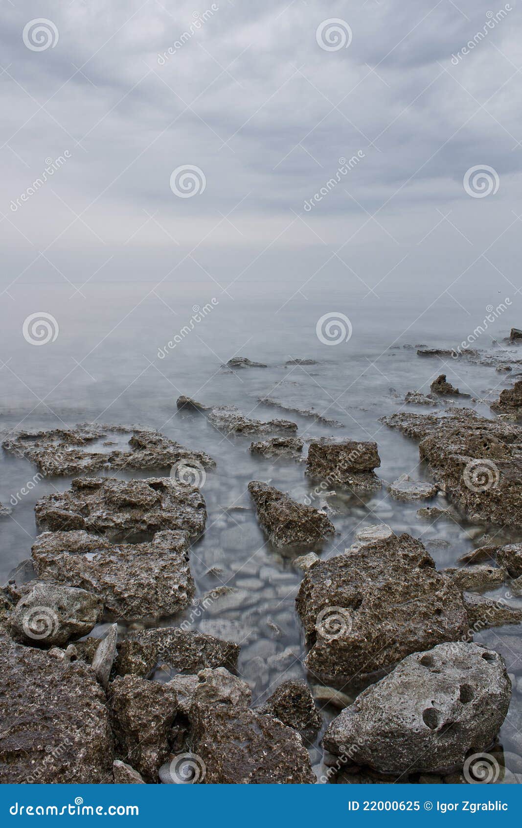 Rocks in the sea stock image. Image of ocean, beach, color - 22000625
