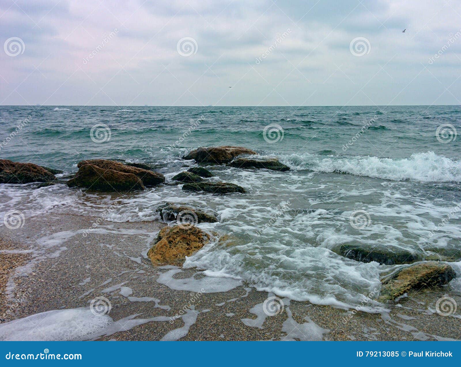 Rocks on shallow water stock image. Image of rocks, clouds - 79213085