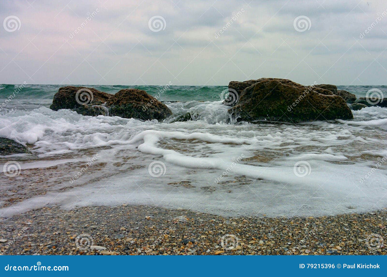 Rocks on shallow water stock photo. Image of coast, splashes - 79215396