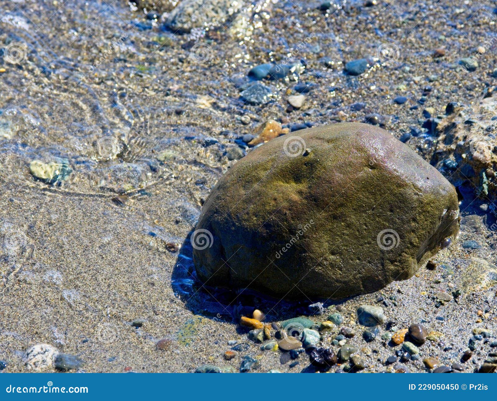 Rocks in the water stock photo. Image of orange, water - 229050450