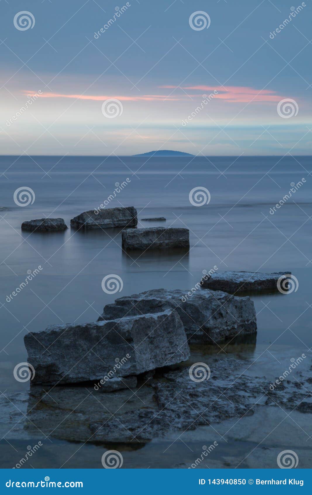 Rocks in Silky Smooth Water after Sunset Stock Photo - Image of lonely ...