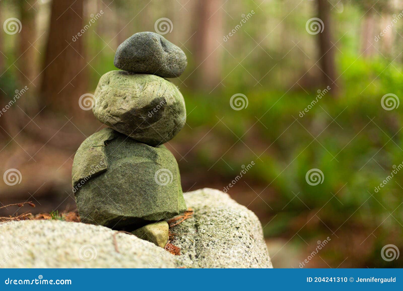 Rocks Stacked on a Large Boulder in a Forest Stock Photo - Image of ...