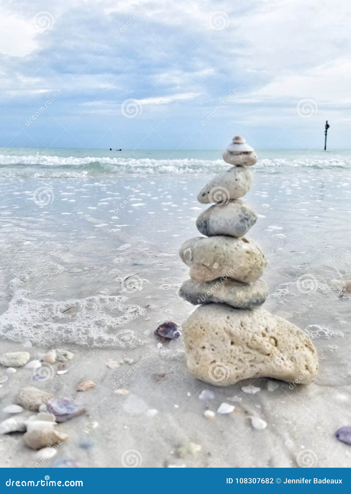 Rocks Stacked Near the Water on the Beach Stock Photo - Image of foam ...
