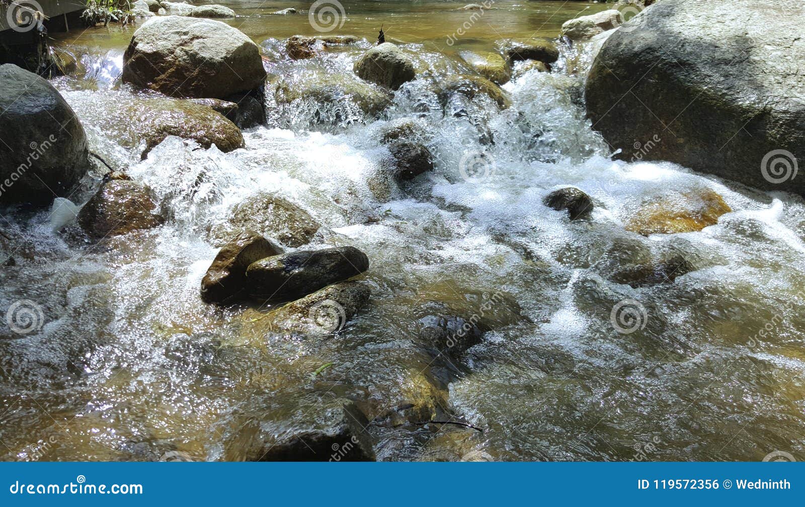 Rocks in Stream with Smooth Flowing Water Stock Photo - Image of creek ...