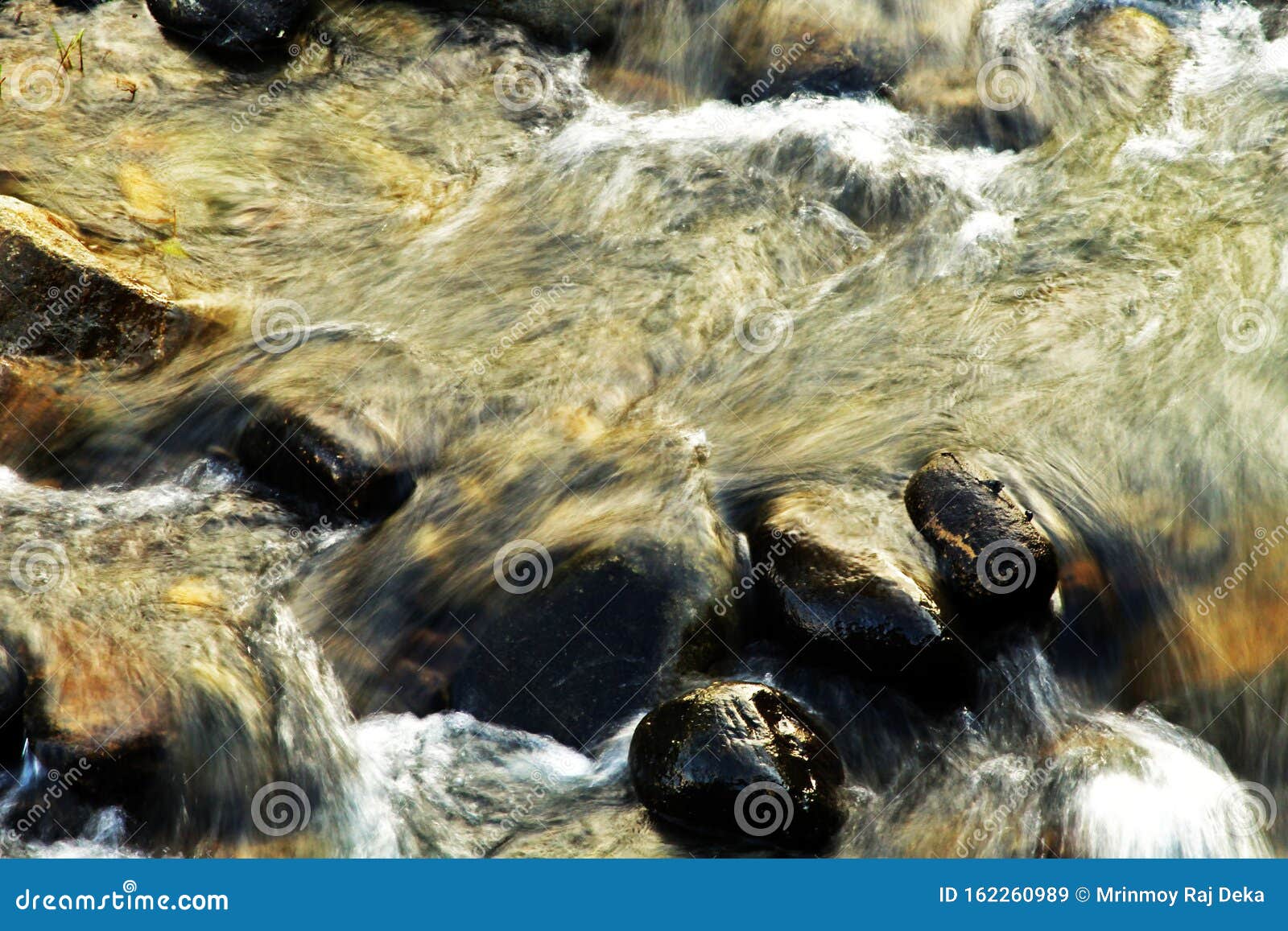 Rocks in Stream with Smooth Flowing Water Stock Image - Image of ...