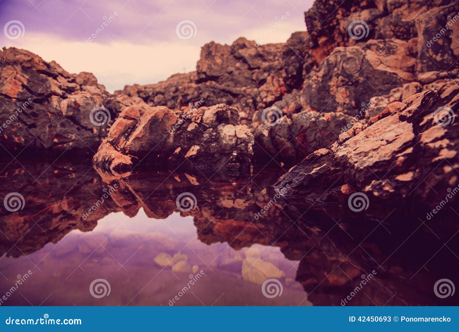 Rocks and Their Reflection in the Sea at Sunrise Stock Image - Image of ...