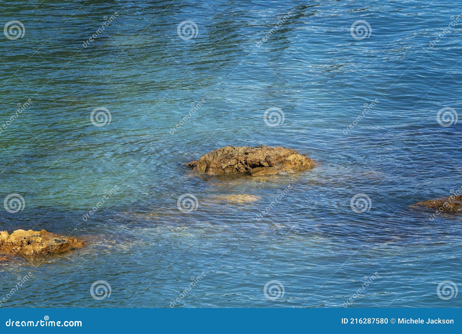 Rocks Visible in the Ocean Water Stock Photo - Image of scenic ...
