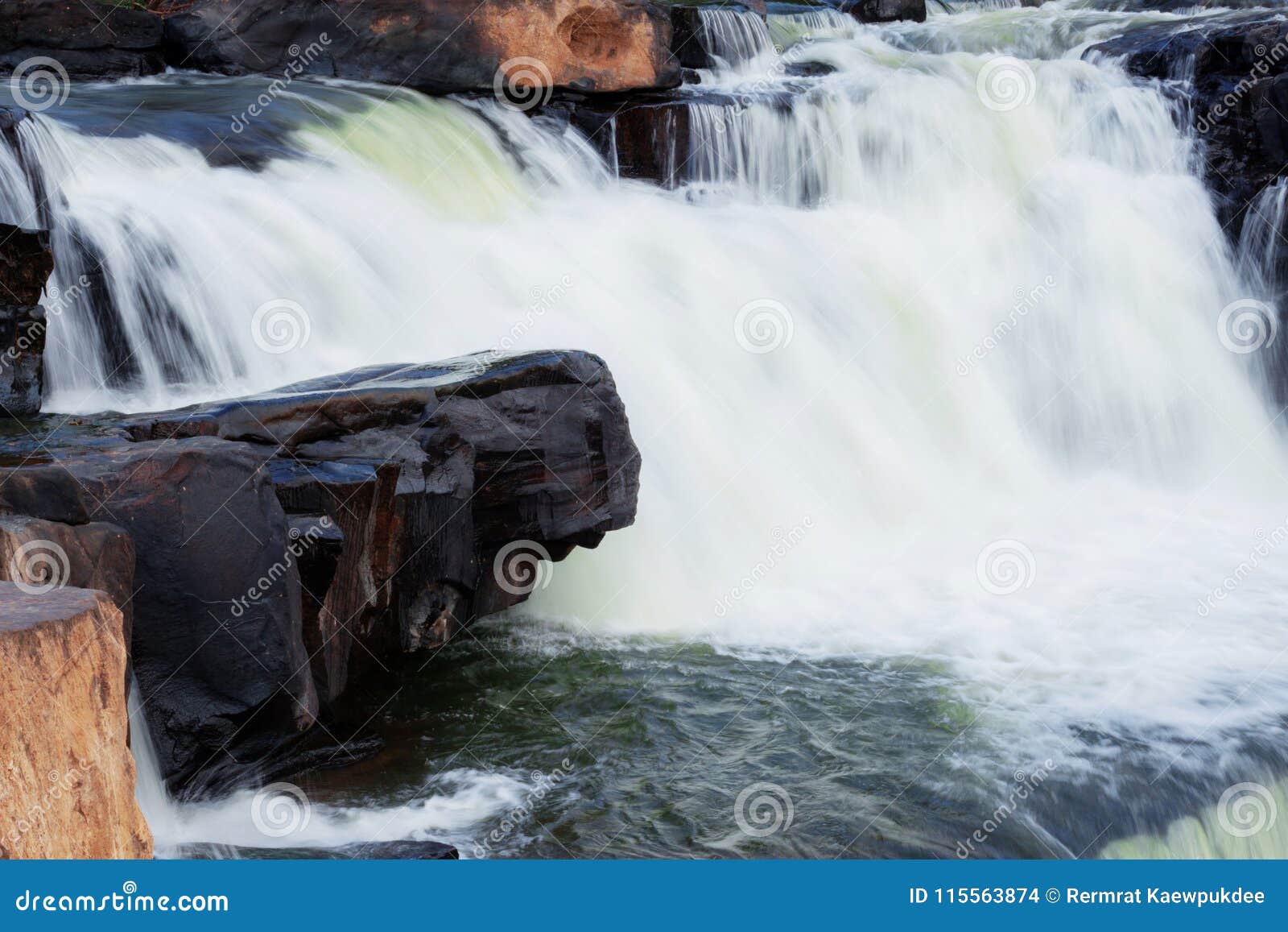 Rocks on the waterfall. stock photo. Image of light - 115563874