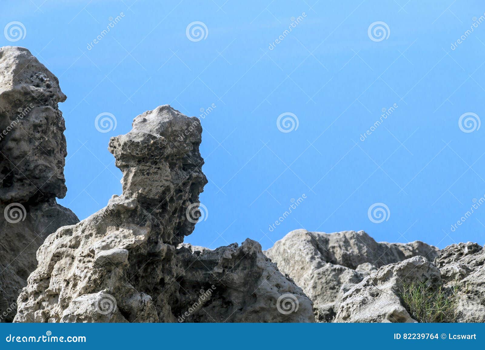 Rocks Weathered into Strange Human-Like Formations on Beach Stock Photo ...