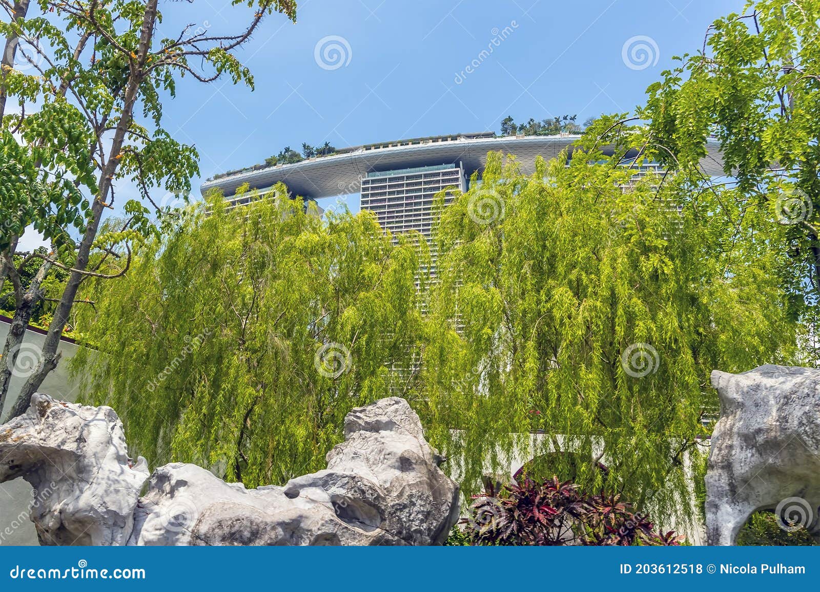 Rocks, Weeping Willows and Ships in the Sky in Singapore, Asia Stock ...