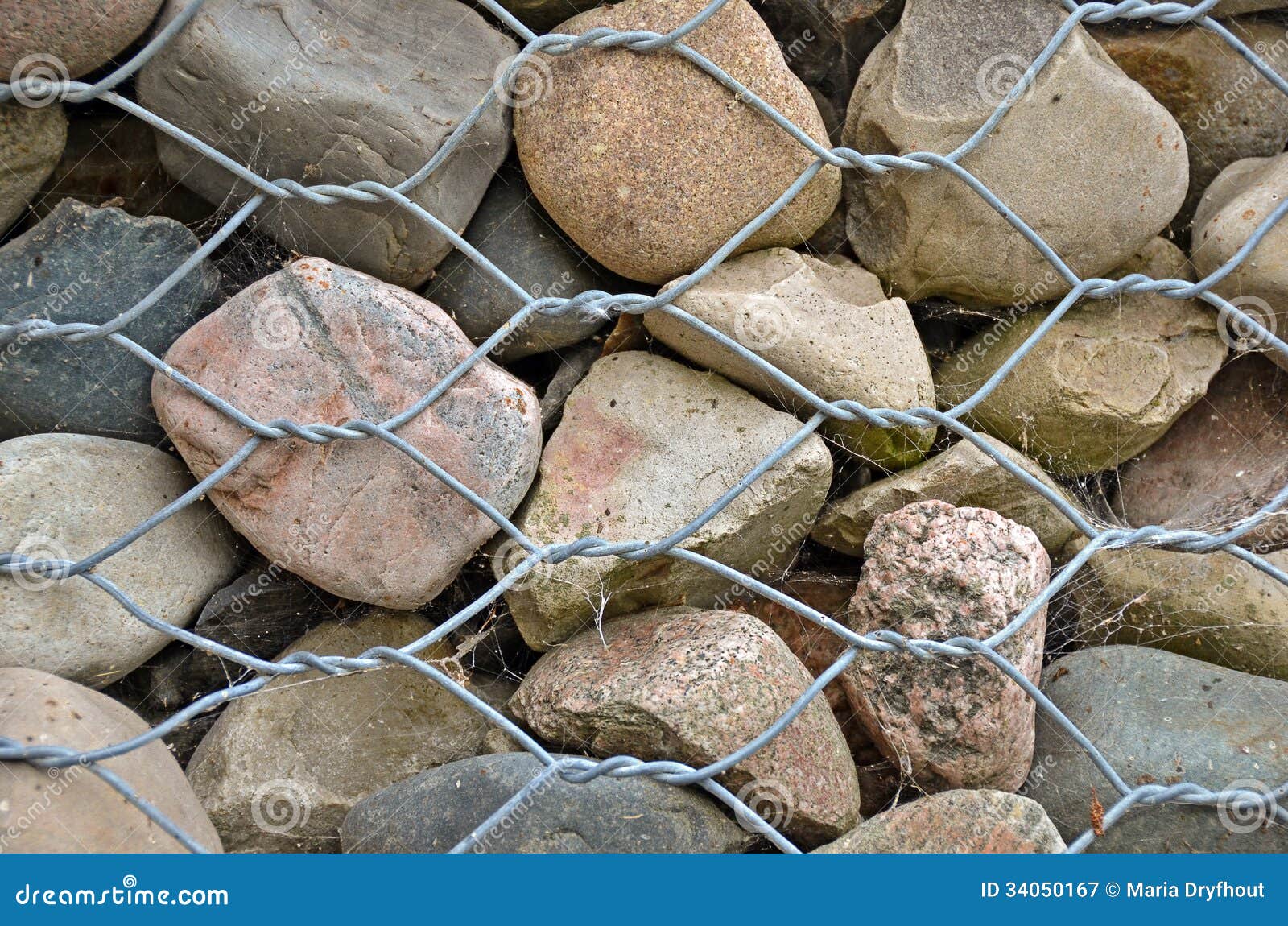 Rocks with wire fence stock image. Image of pattern, texture - 34050167