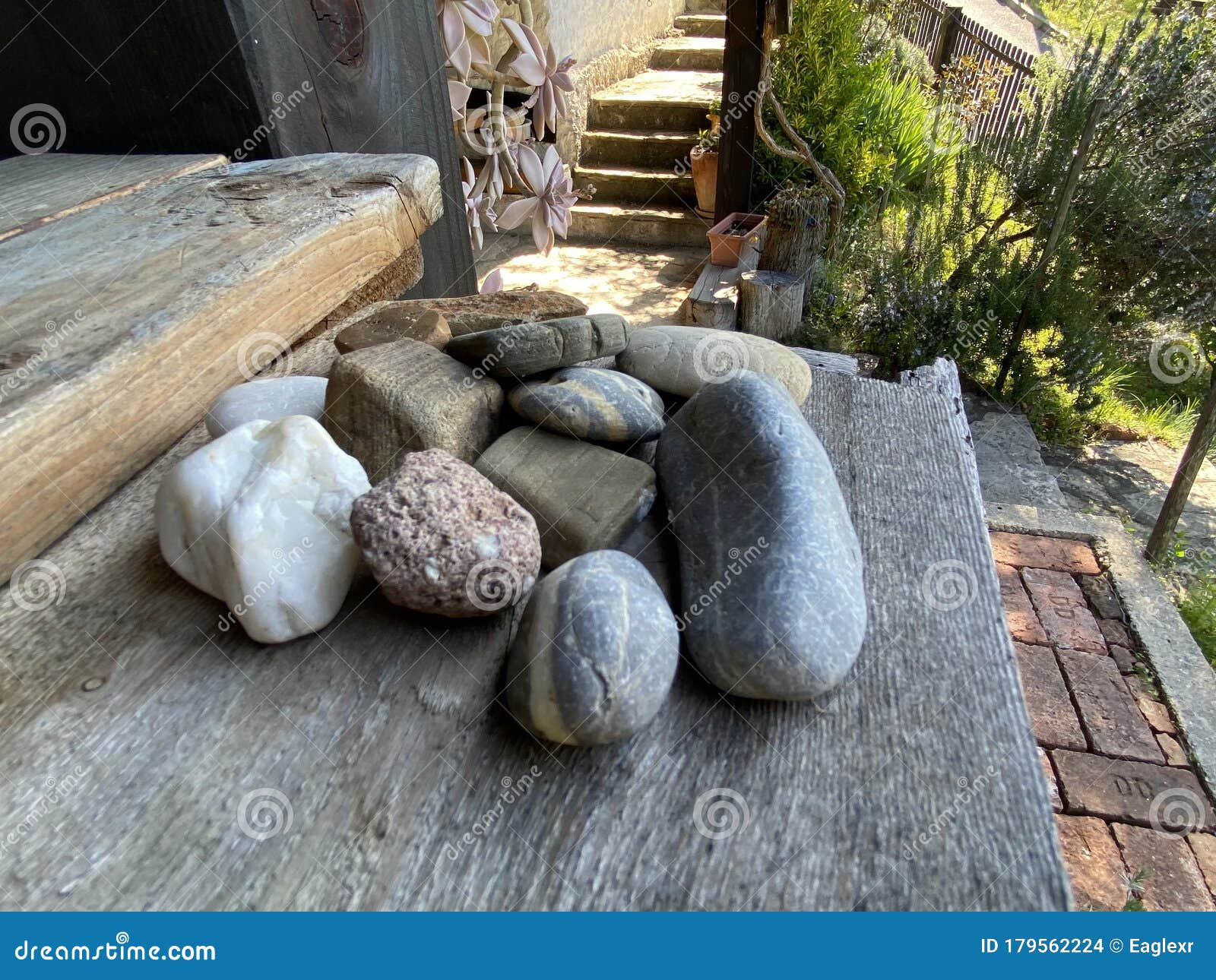 Rocks on wooden table stock photo. Image of stones, closeup - 179562224