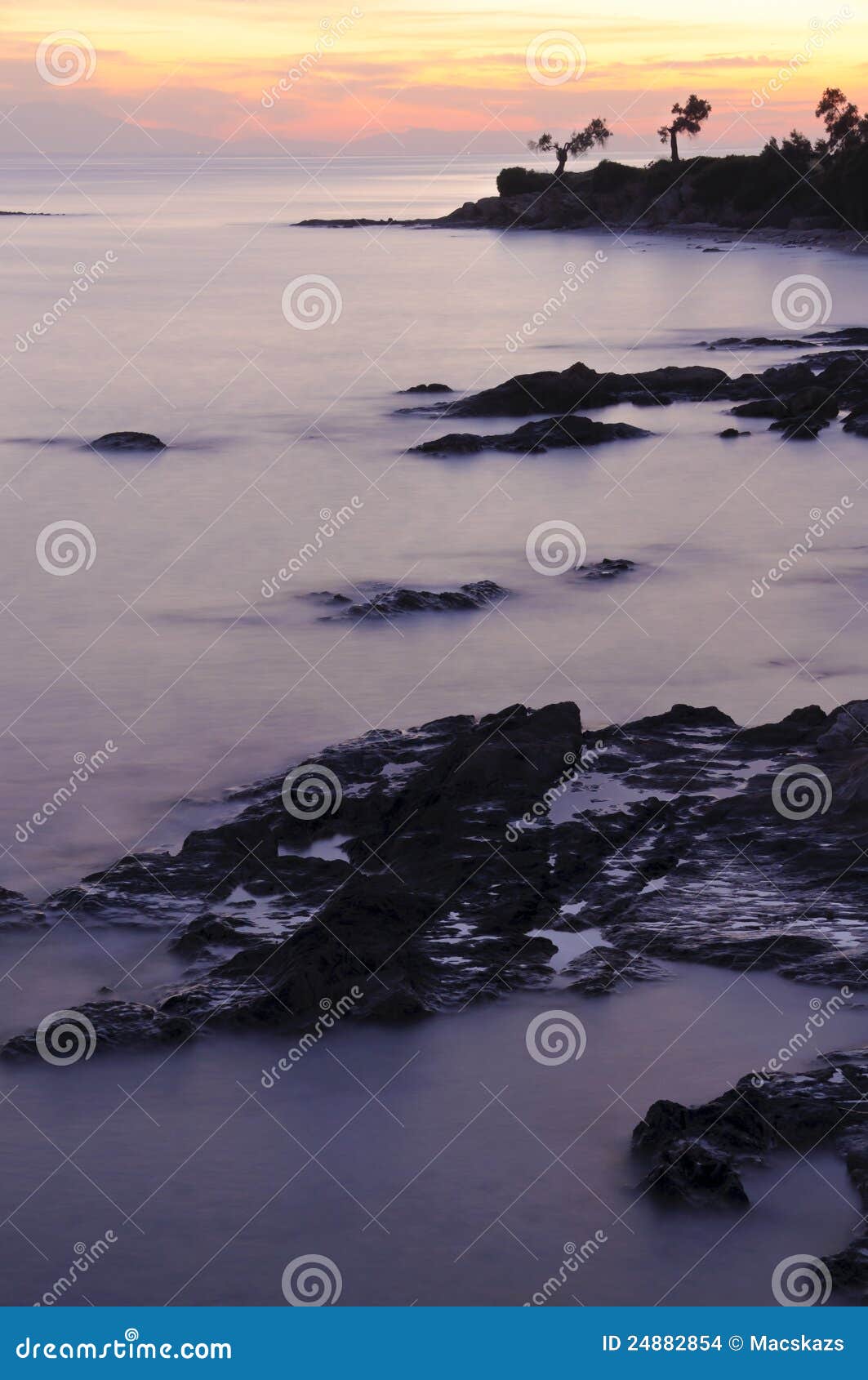 Rocky bay at sunset stock photo. Image of landforms, color - 24882854