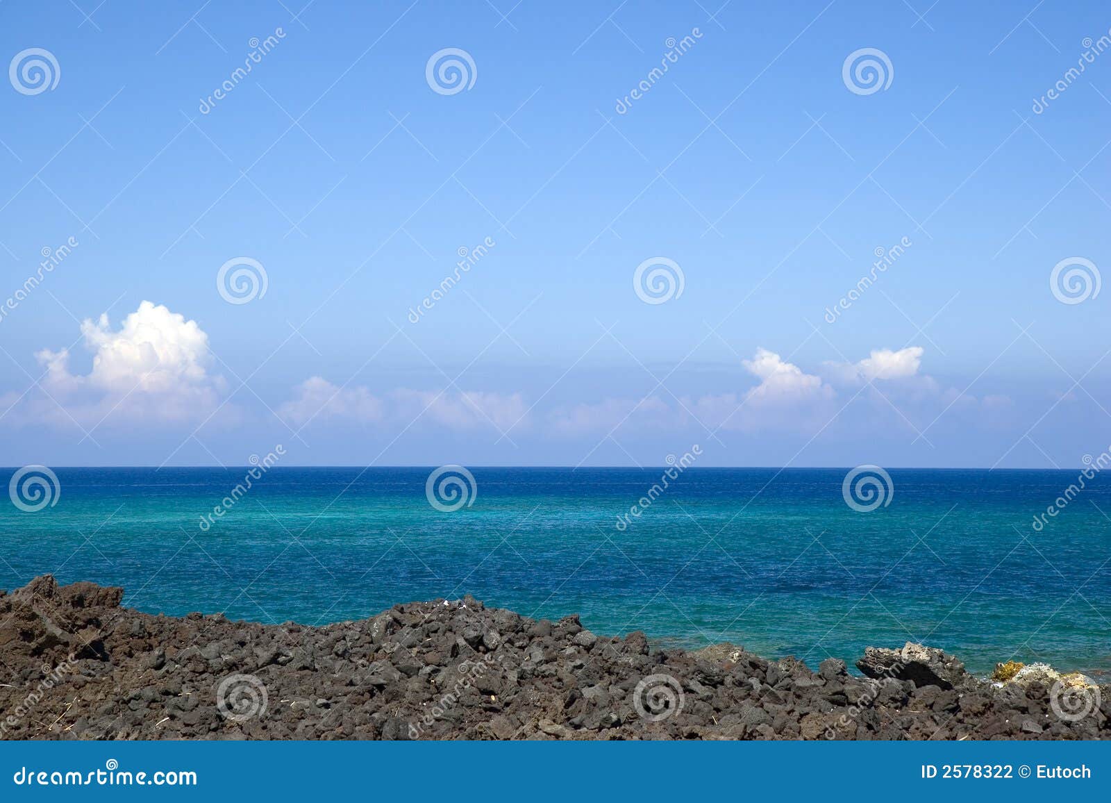 Rocky beach with blue sea stock photo. Image of hawaii - 2578322