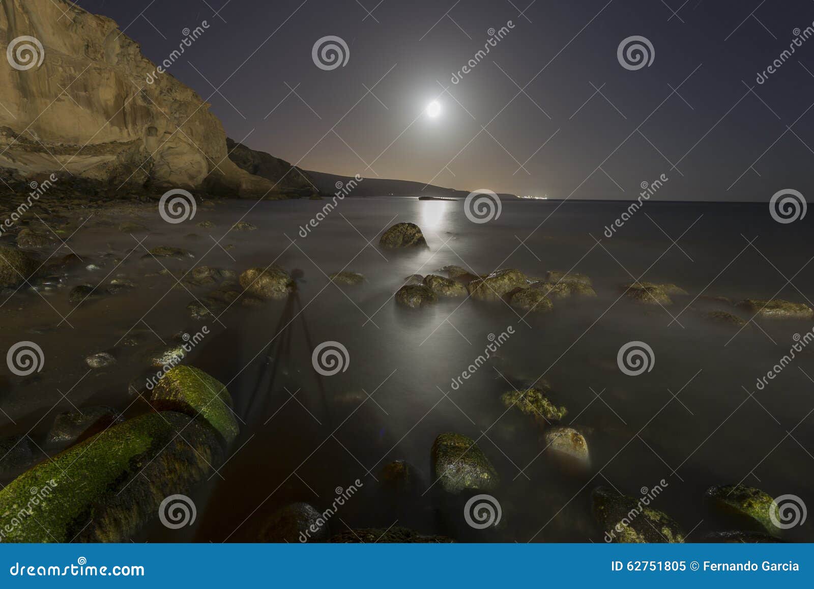 Rocky beach at night stock image. Image of calm, beach - 62751805