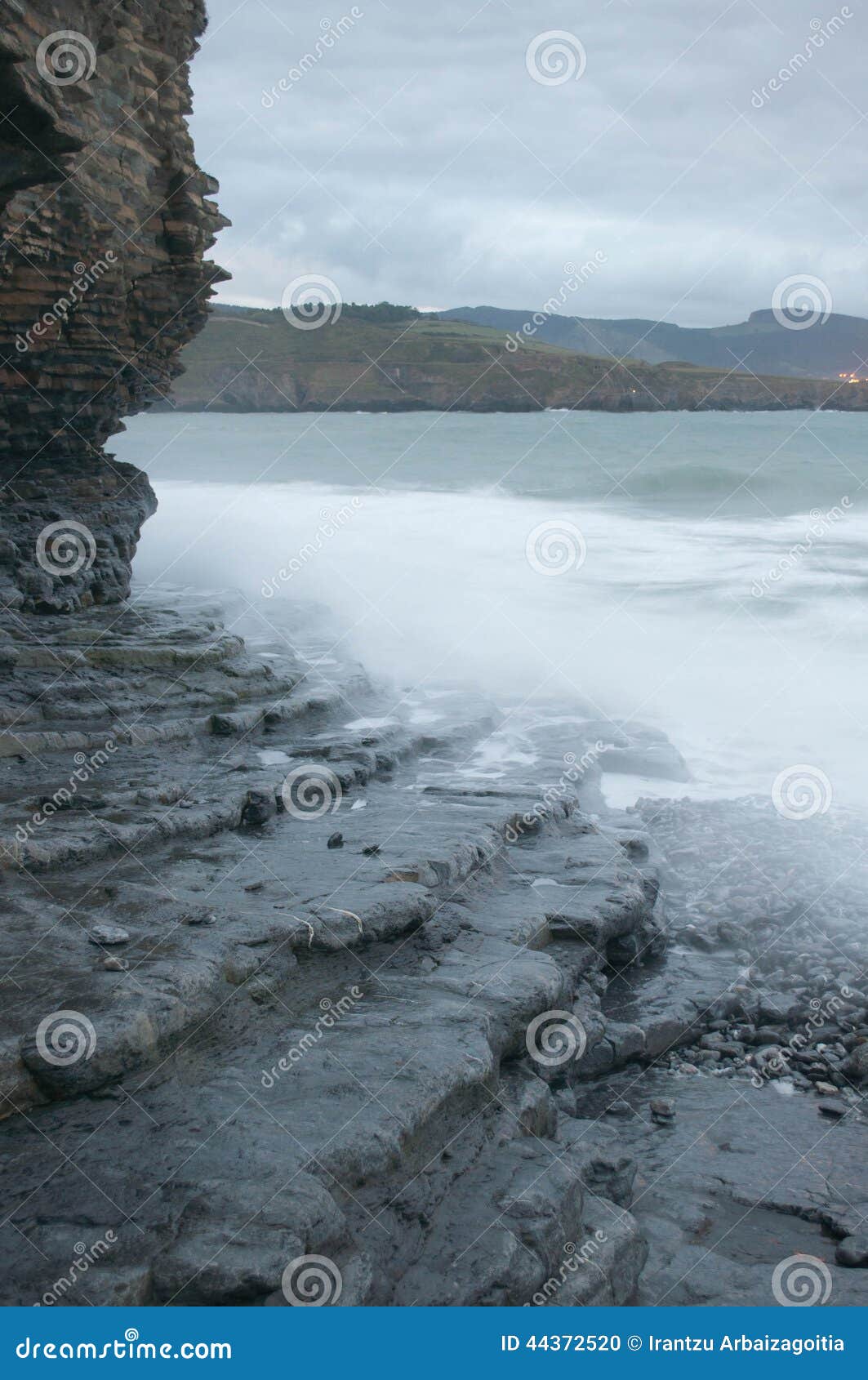 Rocky Beach Shore in a Stormy Sunset Stock Photo - Image of rock, rocks ...