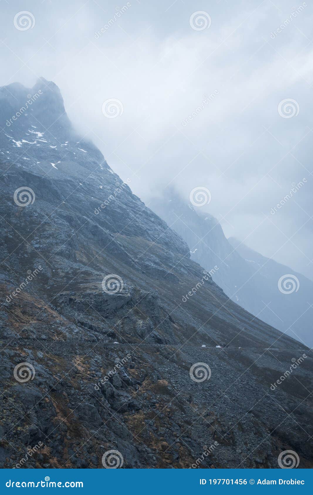 Rocky Cliff with Cloudy Tops Stock Photo - Image of outdoors, mountain ...