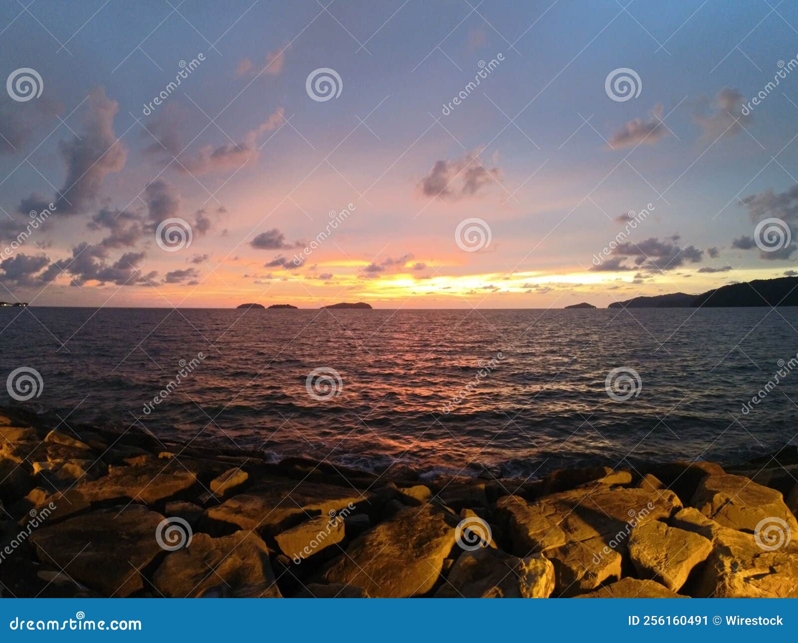 Rocky Cliff Near the Ocean during Sunset Stock Image - Image of island ...