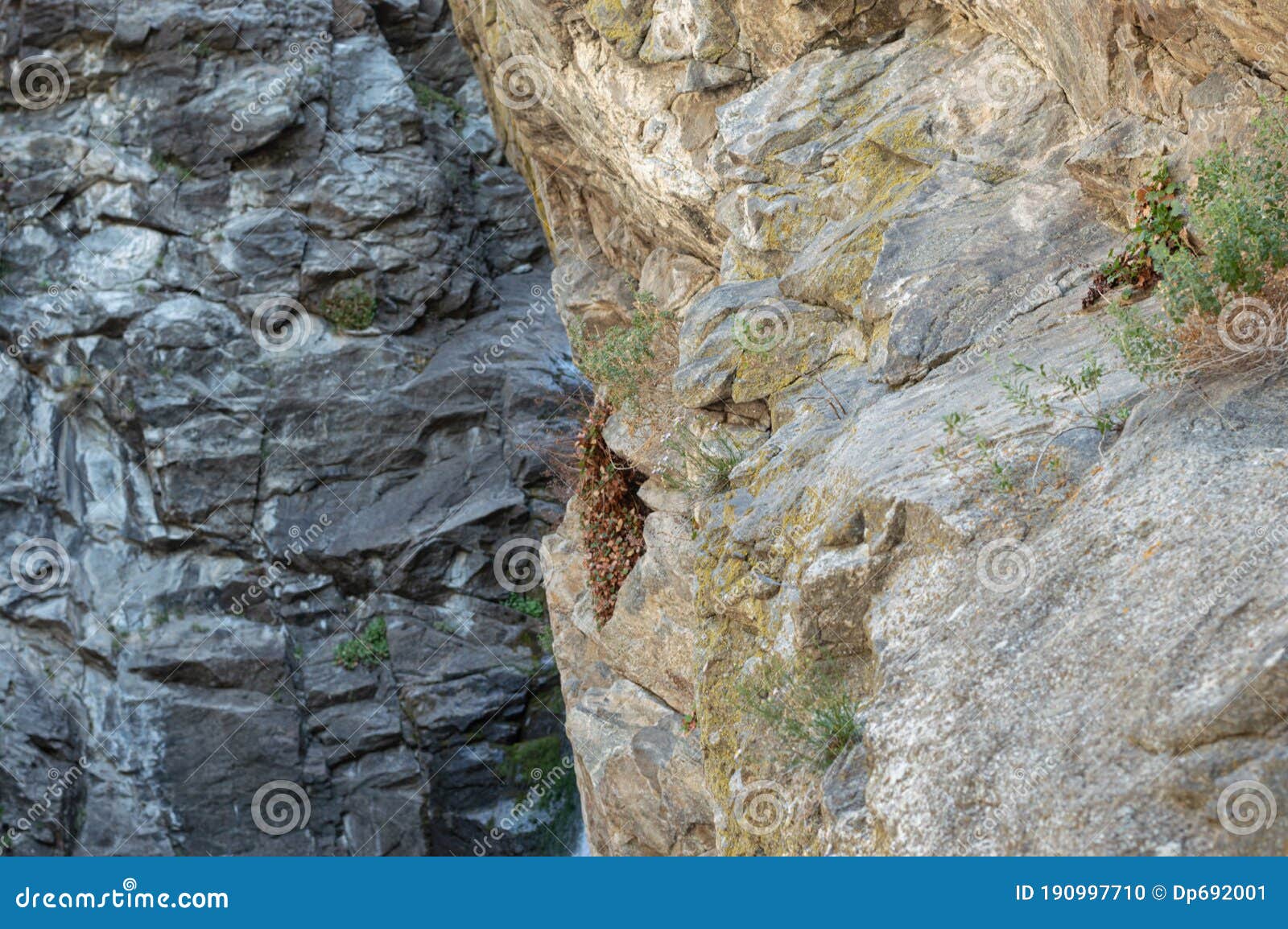 Rocky cliff-side wall stock photo. Image of closeup - 190997710