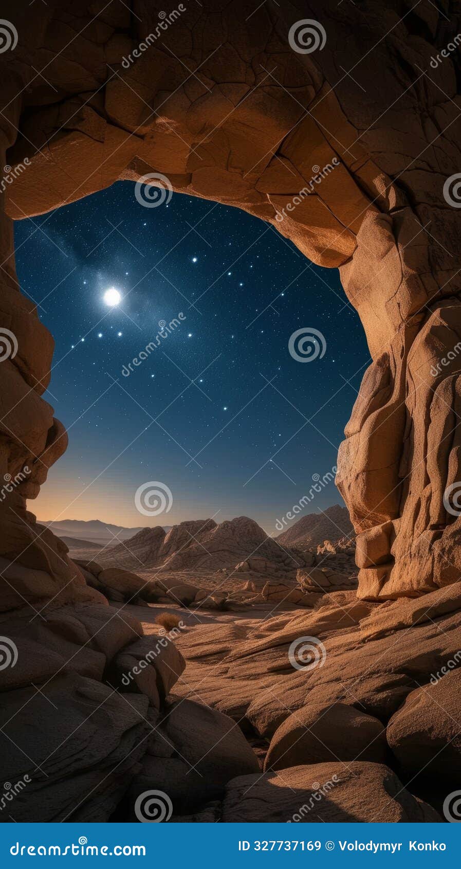 Rocky Desert Arch Framing a Starry Night Sky with Visible Moon Stock ...