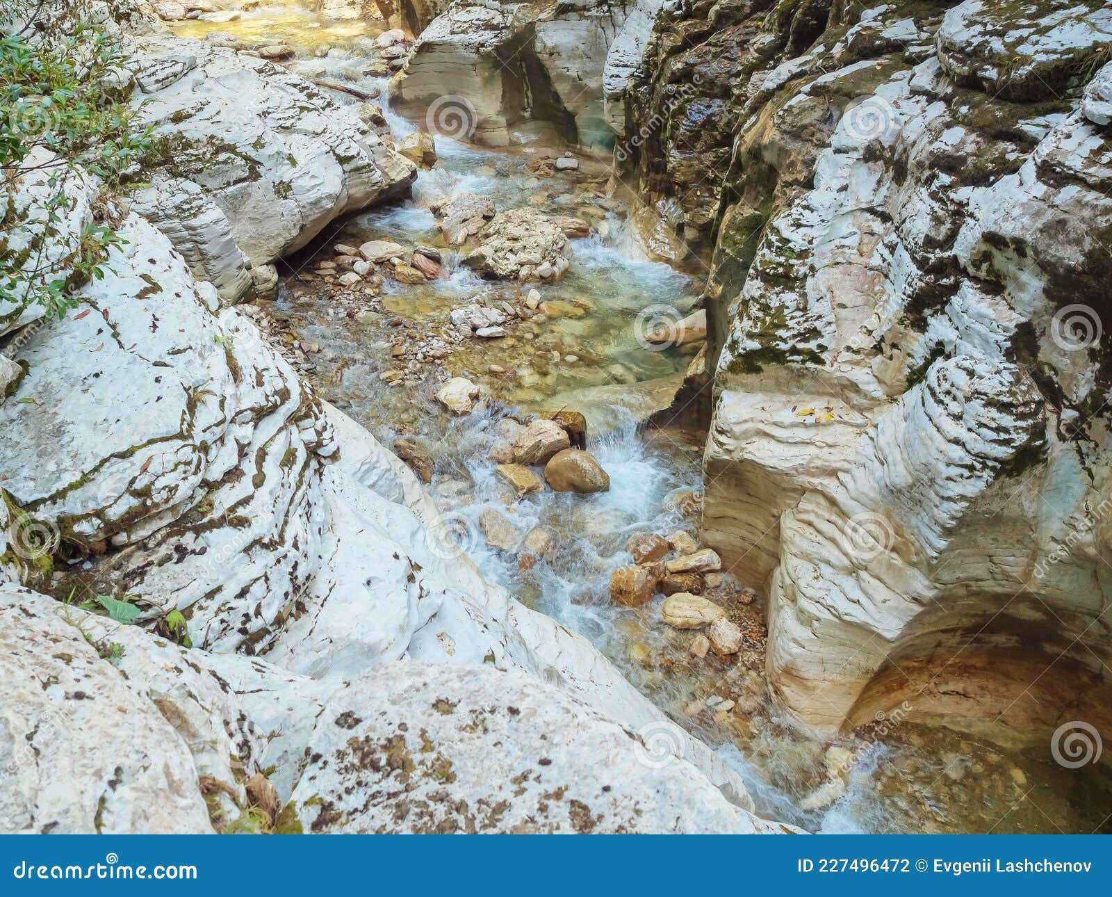 In the Rocky Gorge between the Canyons Flows a Transparent Clean River ...