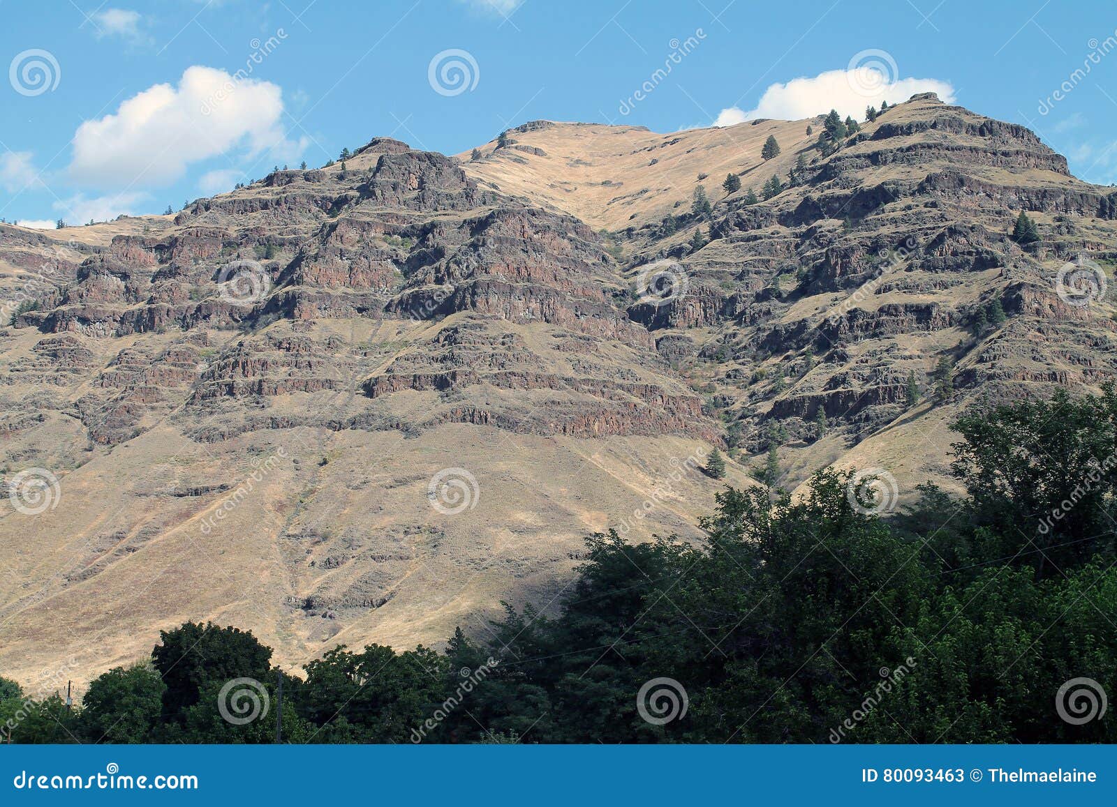 Rocky Hillside in Northeast Oregon with a Blue Sky and White C Stock ...