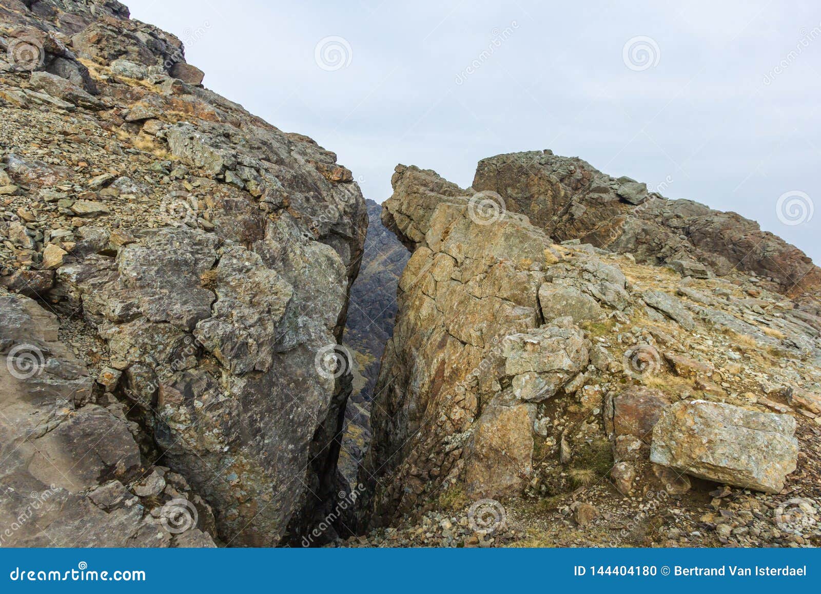 A Rocky Mountain Gully View with Altitude White Clouds Stock Photo ...