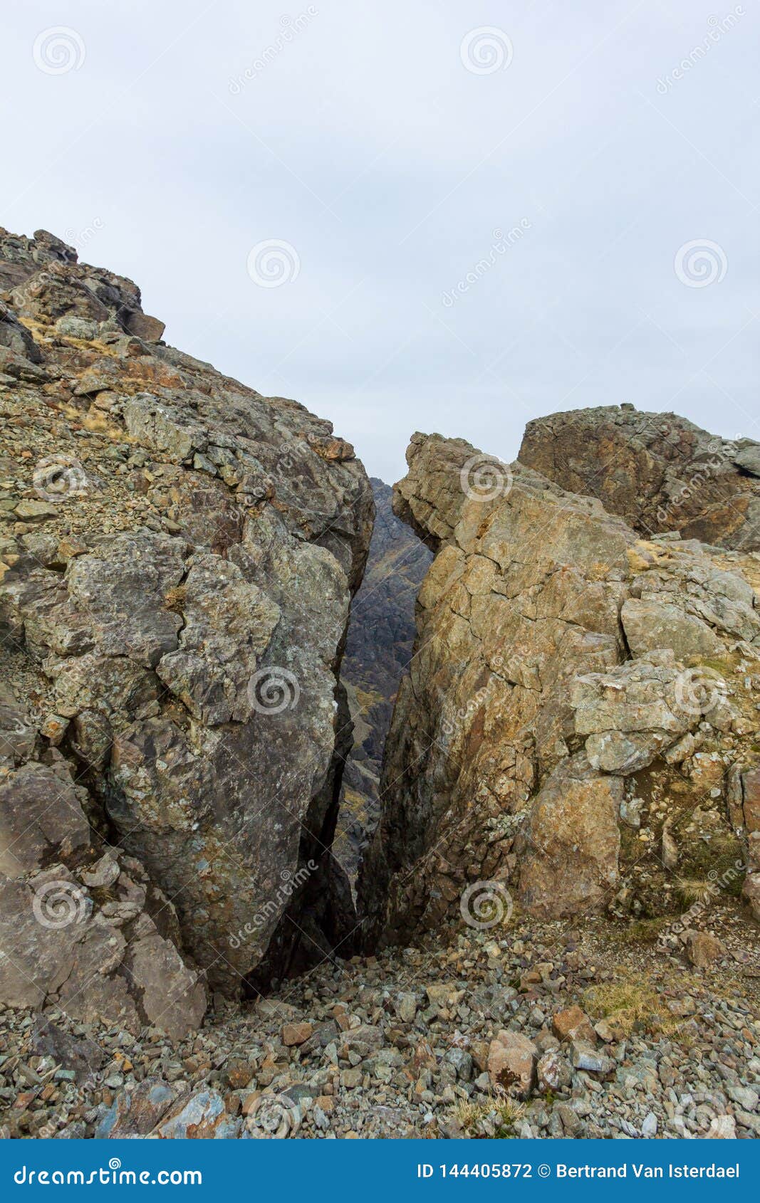 A Rocky Mountain Gully View with Altitude White Clouds Stock Photo ...