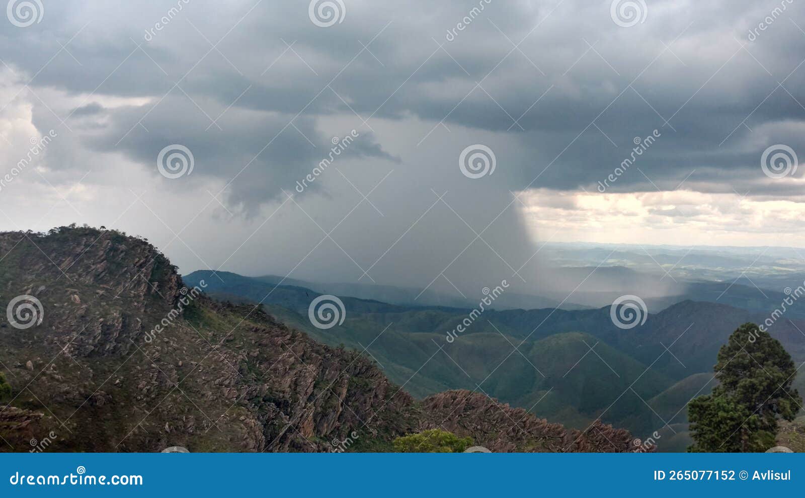 Rocky Mountain in a Valley Where the Rain is Coming Stock Photo - Image ...