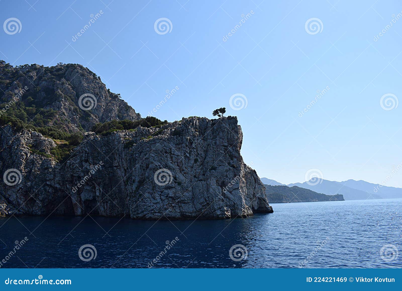 Rocky Promontory with a Lonely Pine Tree Stock Image - Image of ...