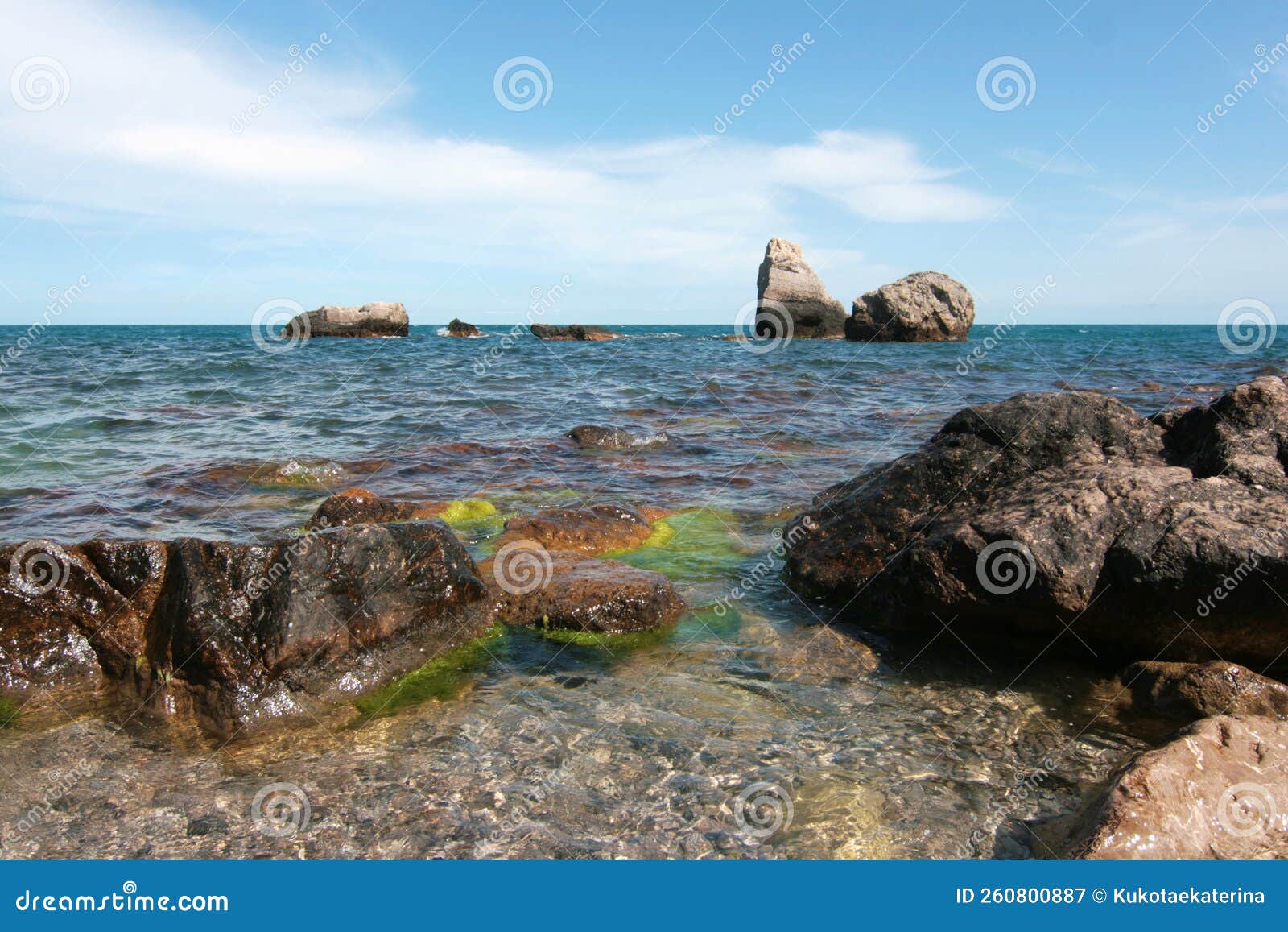A Rocky Seashore with Large Stones in the Water Stock Image - Image of ...