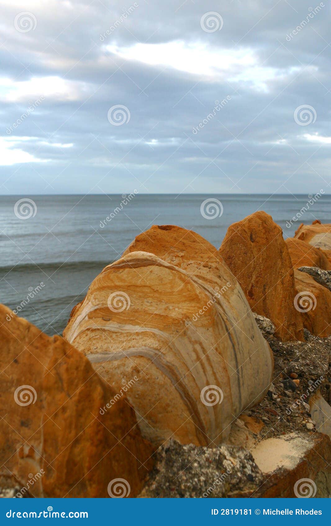Rocky Seawall 1 stock image. Image of coast, cloud, clouds - 2819181