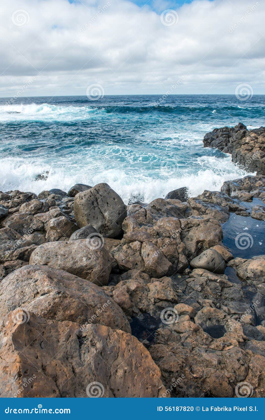 Rocky shore stock photo. Image of cloudy, rock, ocean - 56187820