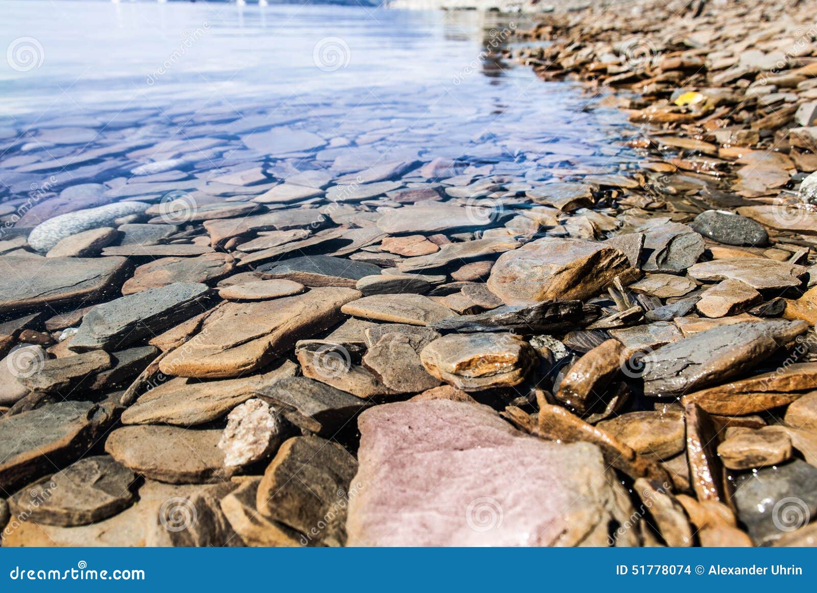 Rocky shore of the lake stock photo. Image of horizon - 51778074