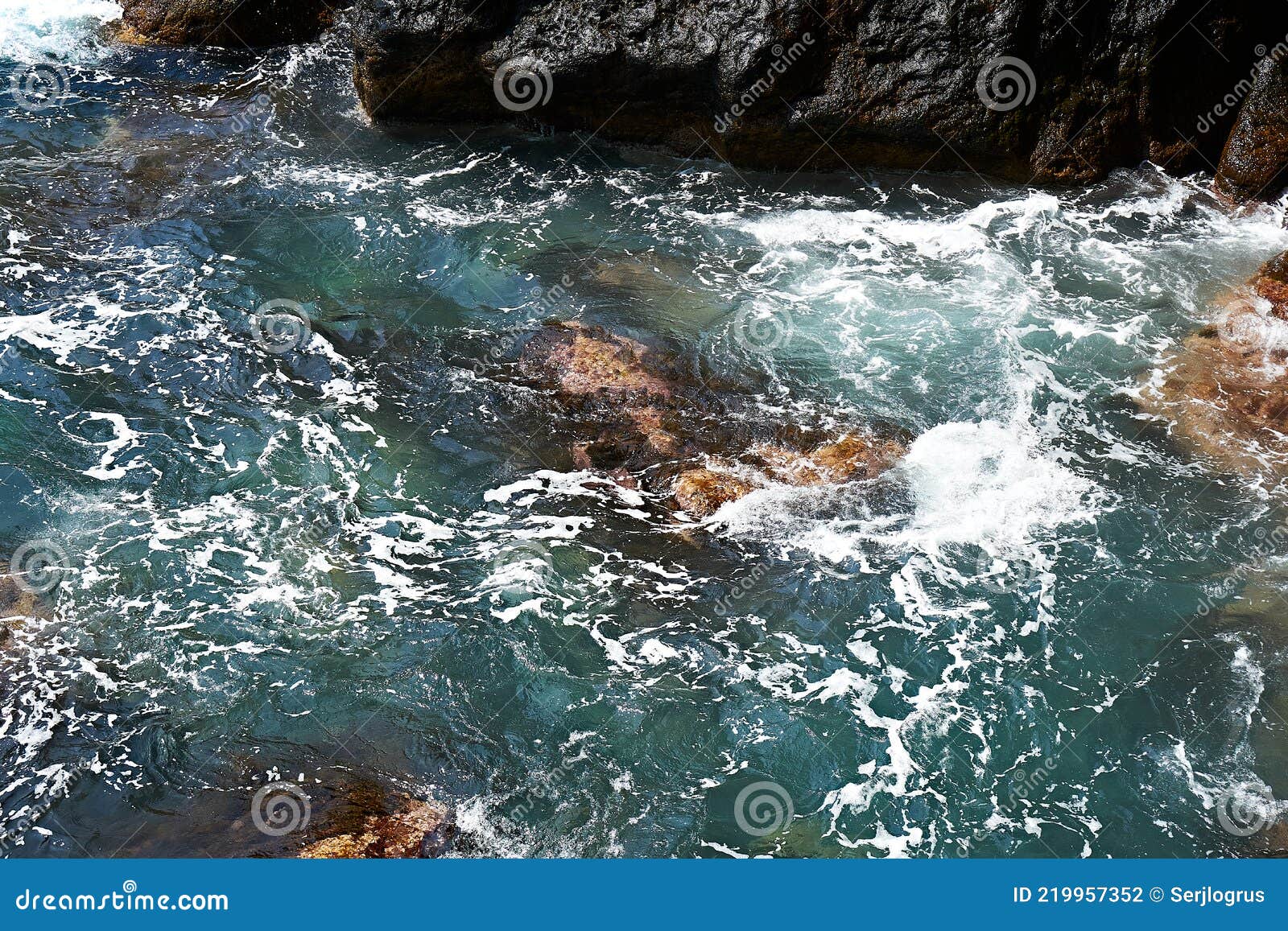 Rocky shore. Tidal bore stock photo. Image of liquid - 219957352