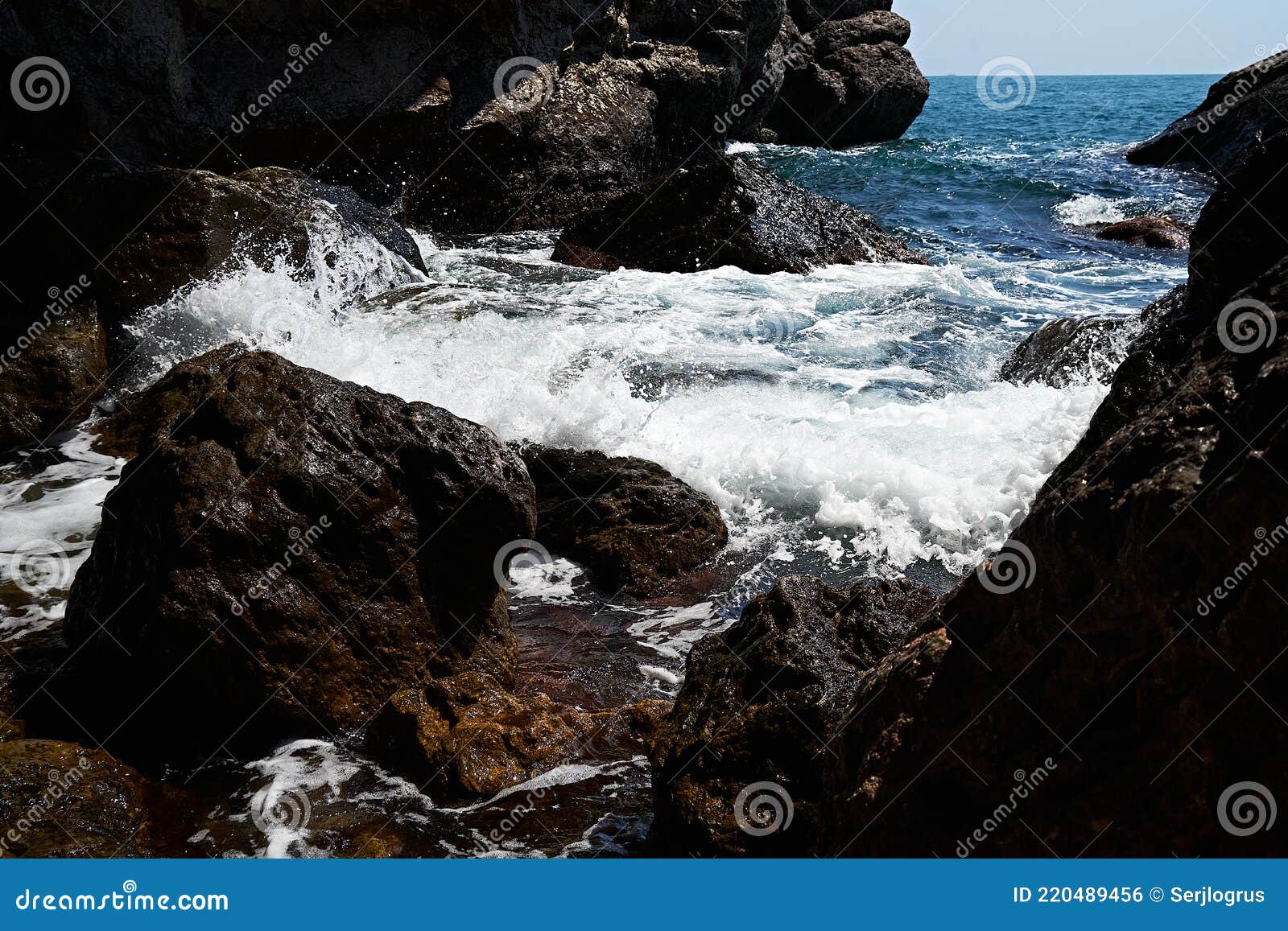 Rocky shore. Tidal bore stock photo. Image of horizon - 220489456