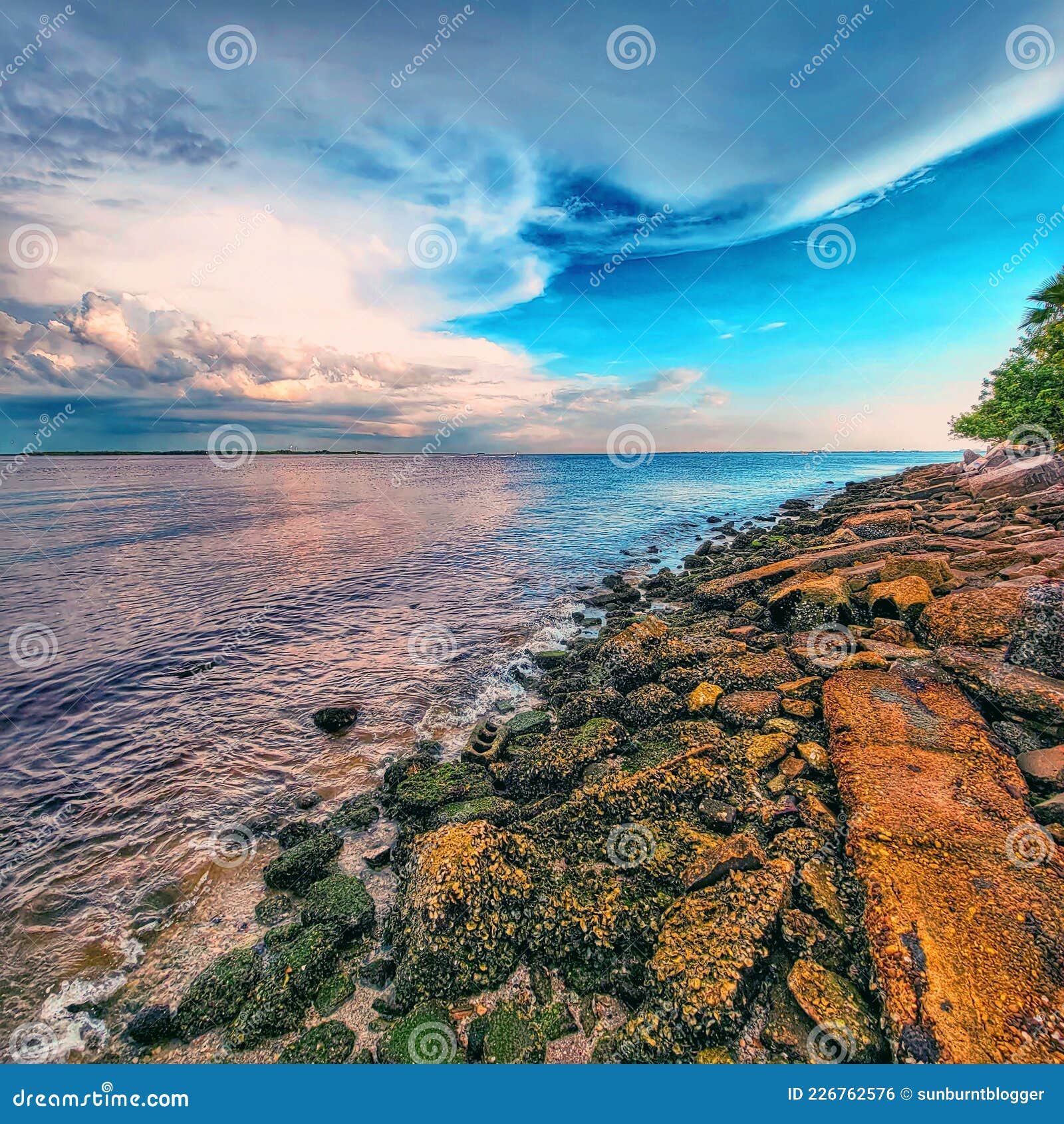 Rocky Shoreline during Sunset Stock Photo - Image of terrain, shore ...