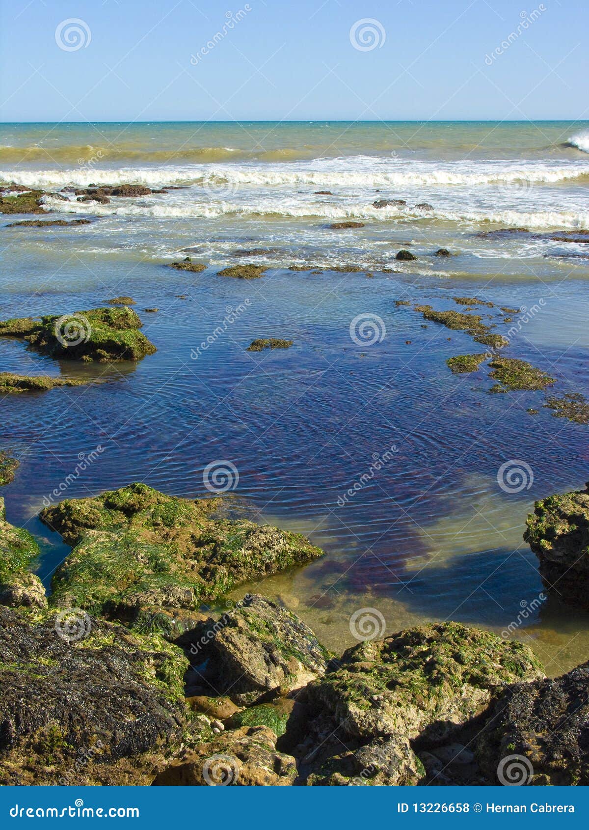 Rocky tidal beach stock photo. Image of scenery, beach - 13226658