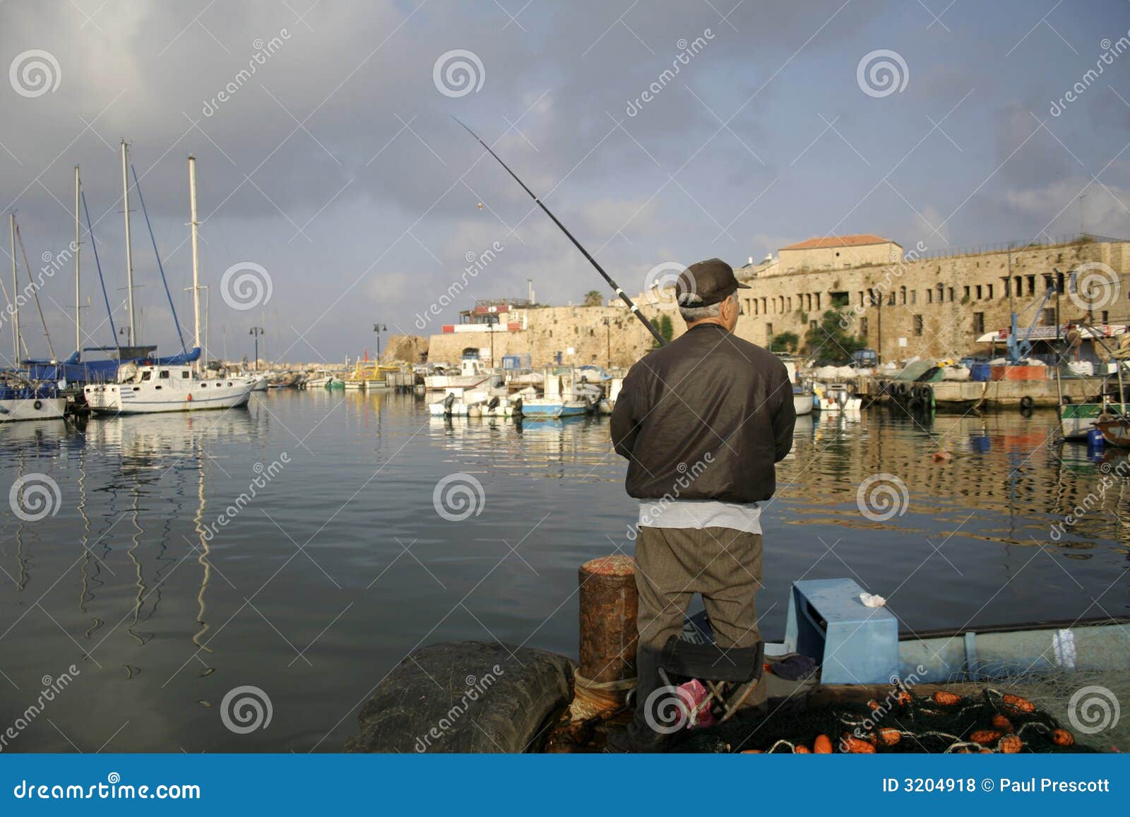 Rod Fisherman in Akko Harbour Stock Photo - Image of buoy, reel: 3204918