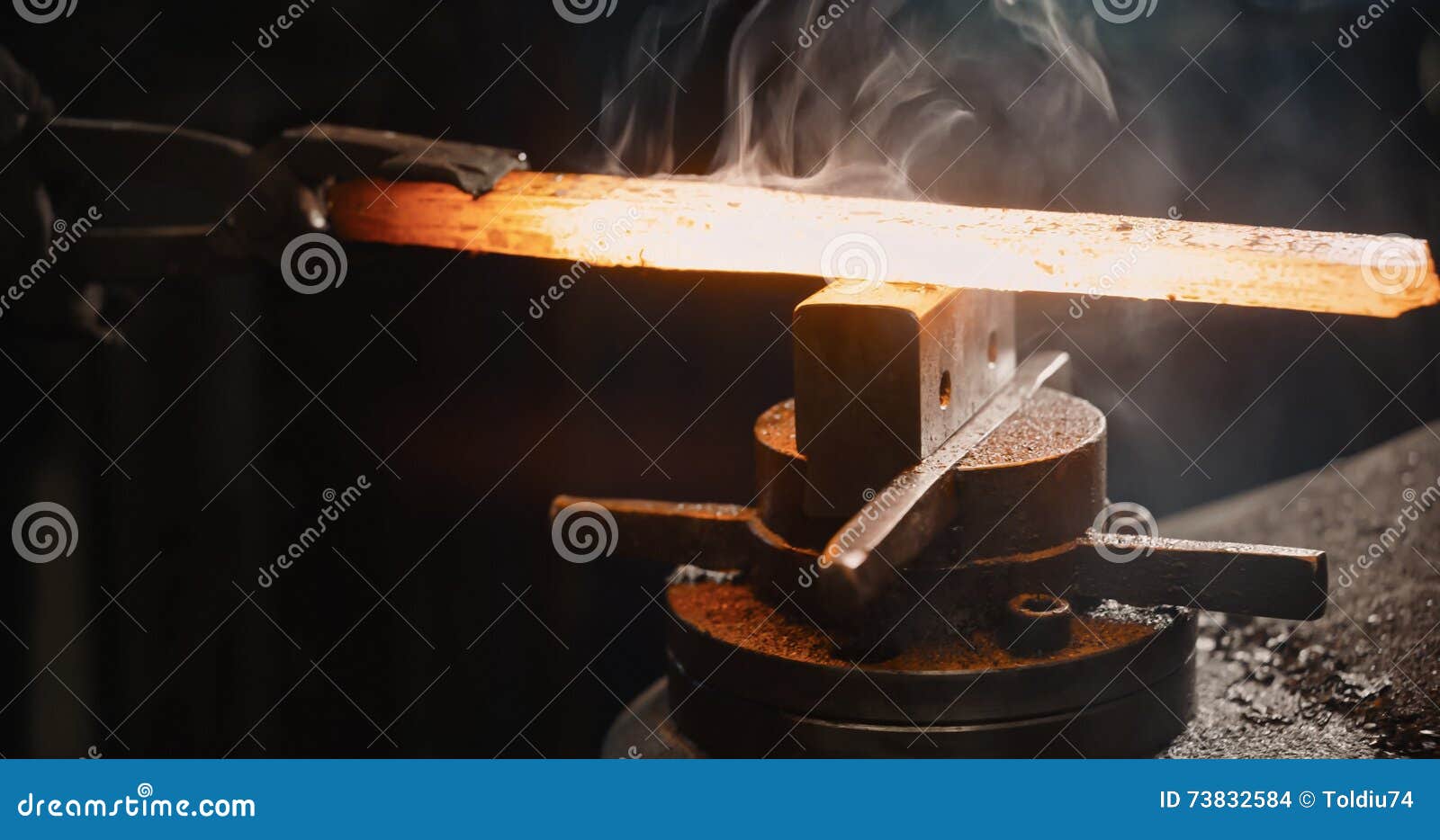 Rod hot iron on the anvil. stock photo. Image of force - 73832584
