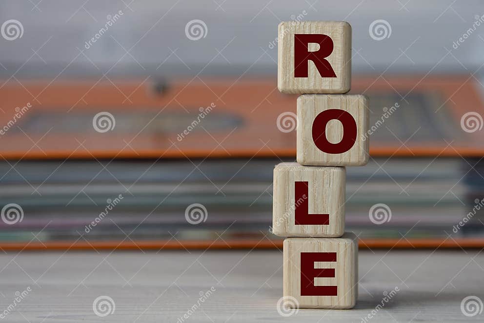 ROLE - Word on Wooden Cubes on the Background of a Folder with ...