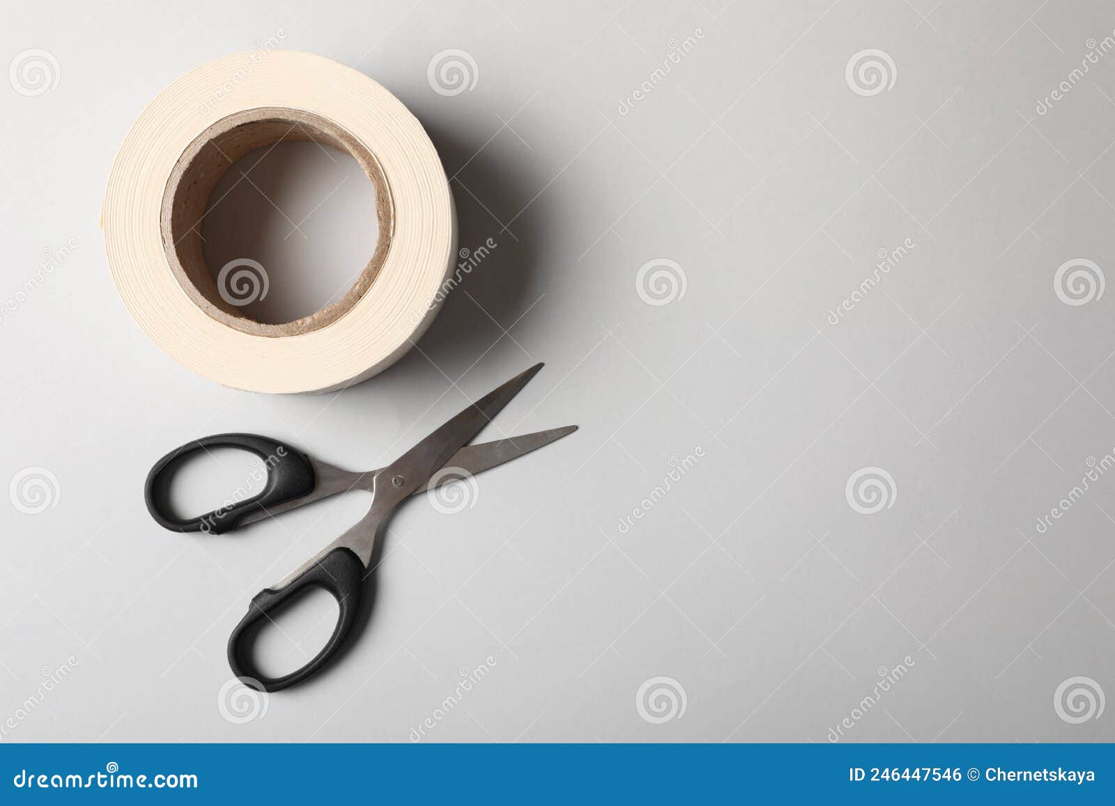 Roll of Adhesive Tape and Scissors on Light Background, Top View. Space ...