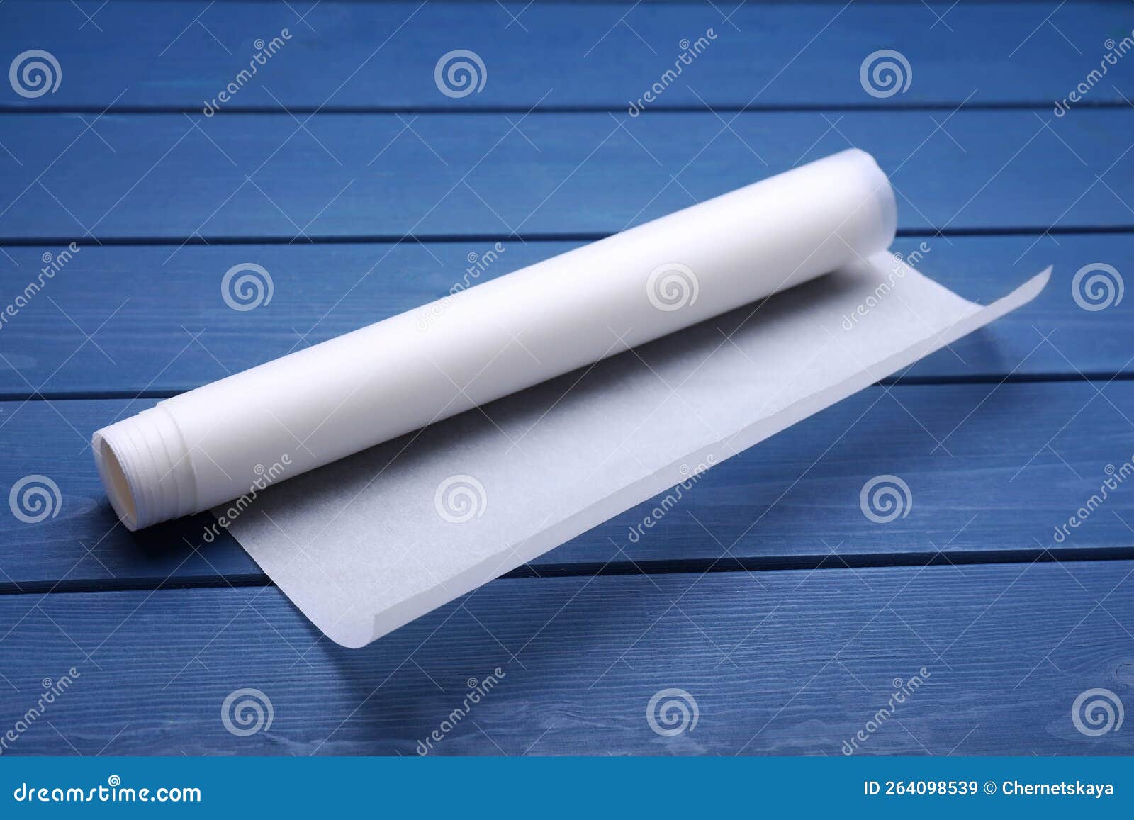 Roll of Baking Paper on Blue Wooden Table Stock Image - Image of baking ...