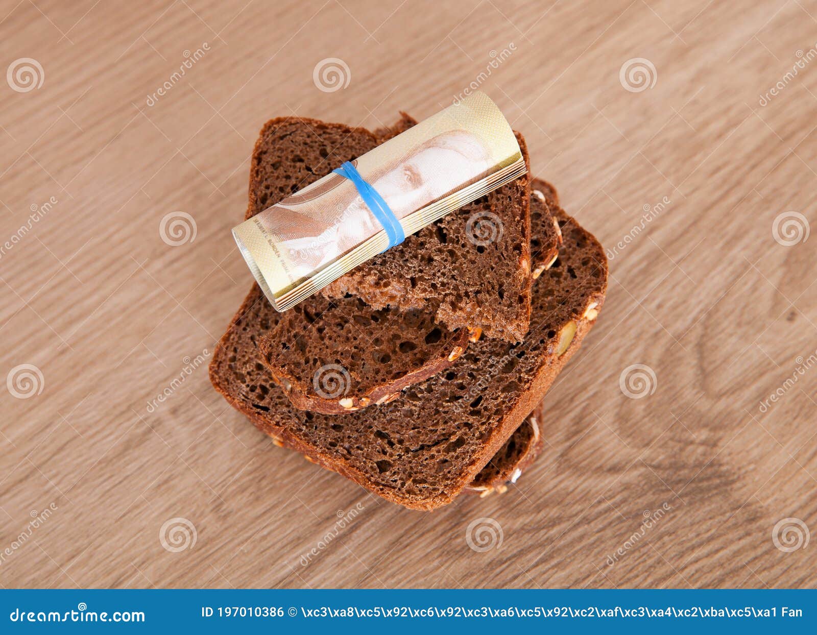 A Roll of Canadian Dollar Bills and Black Bread Stock Photo - Image of ...