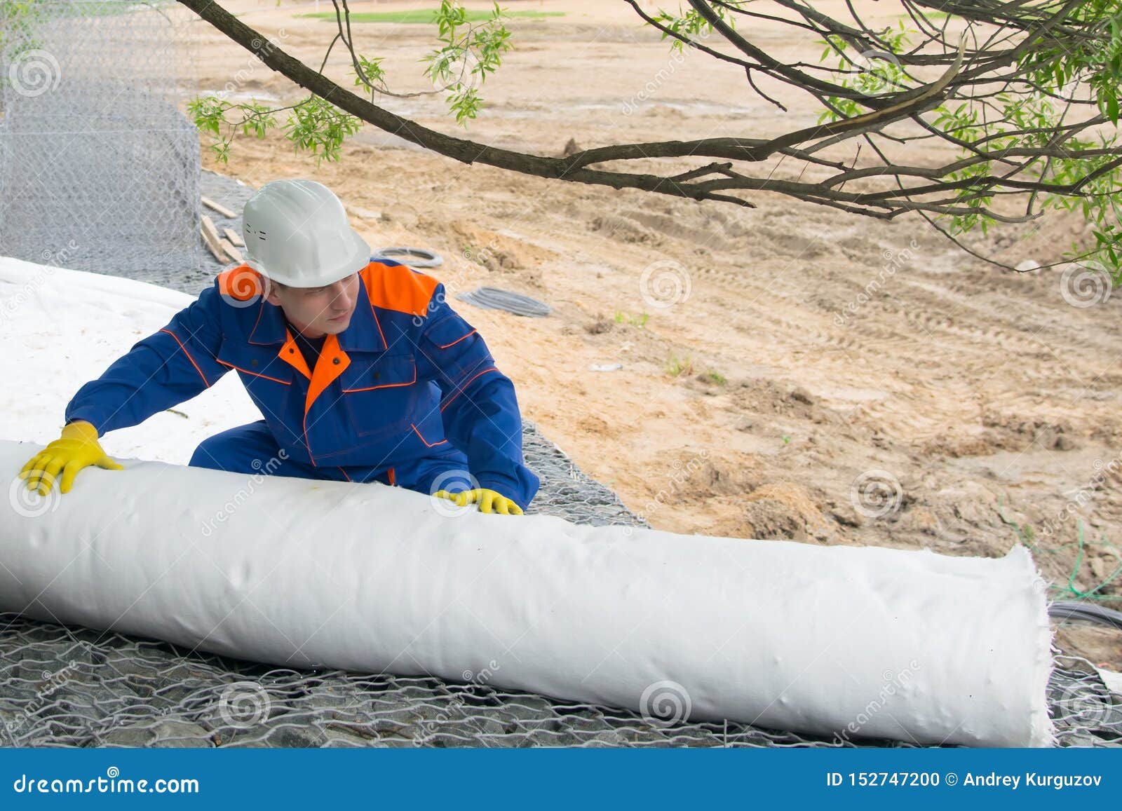 A Roll of Cloth To Protect the Surface of the Soil, Unwinding a Worker ...
