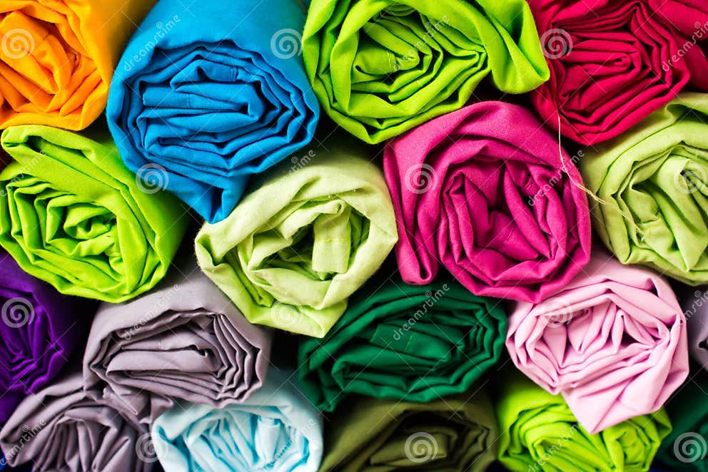 Roll Clothes To Sort through the Mess. Stock Image - Image of blue ...
