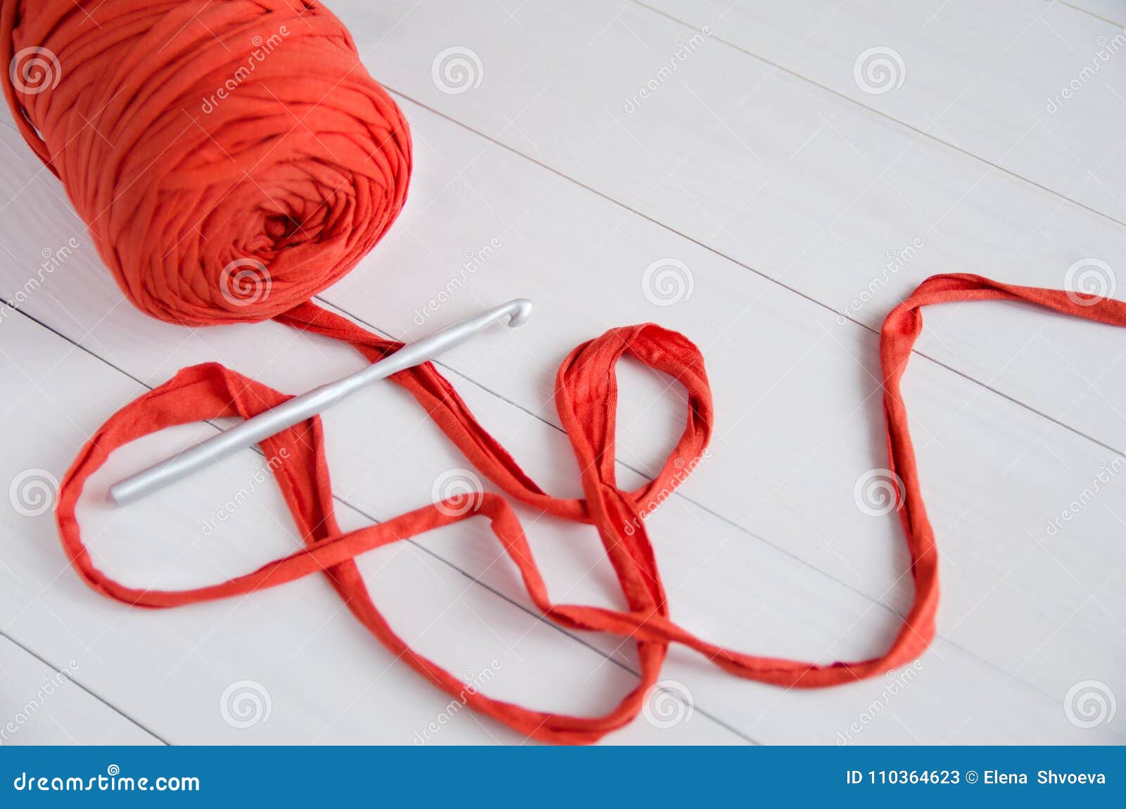 Roll the Cotton Yarn and Crochet Hook on White Wooden Background. the ...