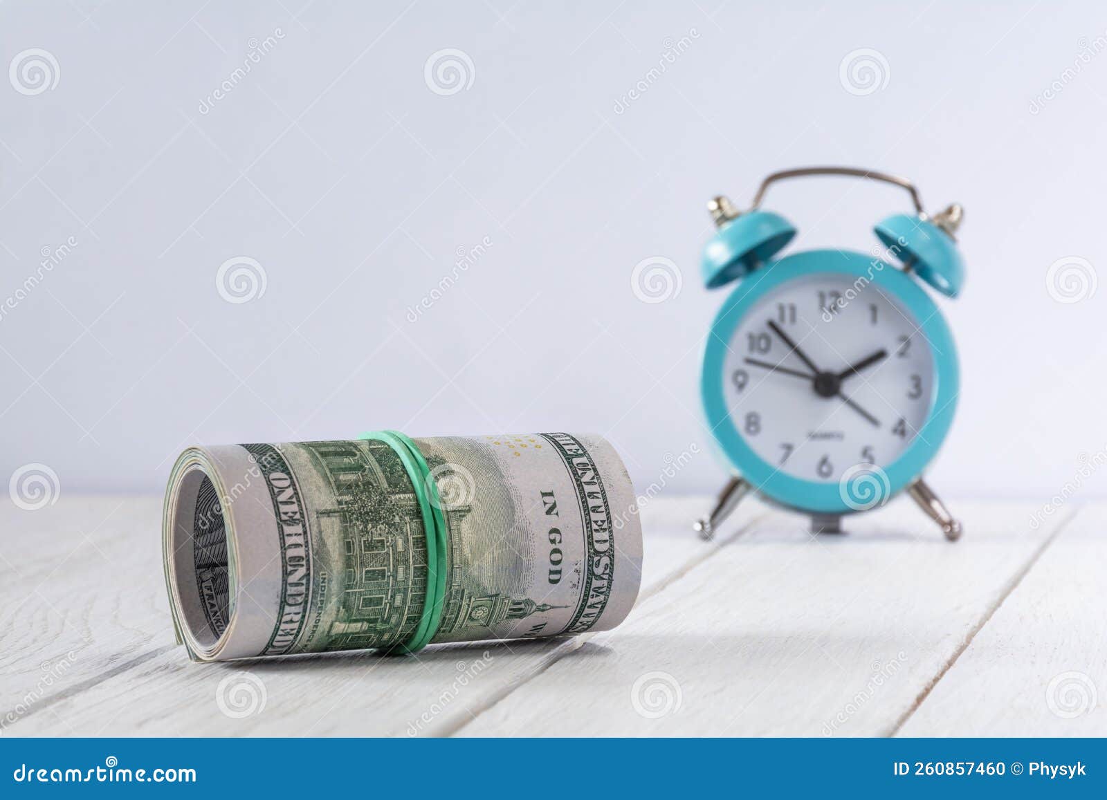 Roll of Dollar Bills and Clock. Time is Money Concept Stock Photo ...