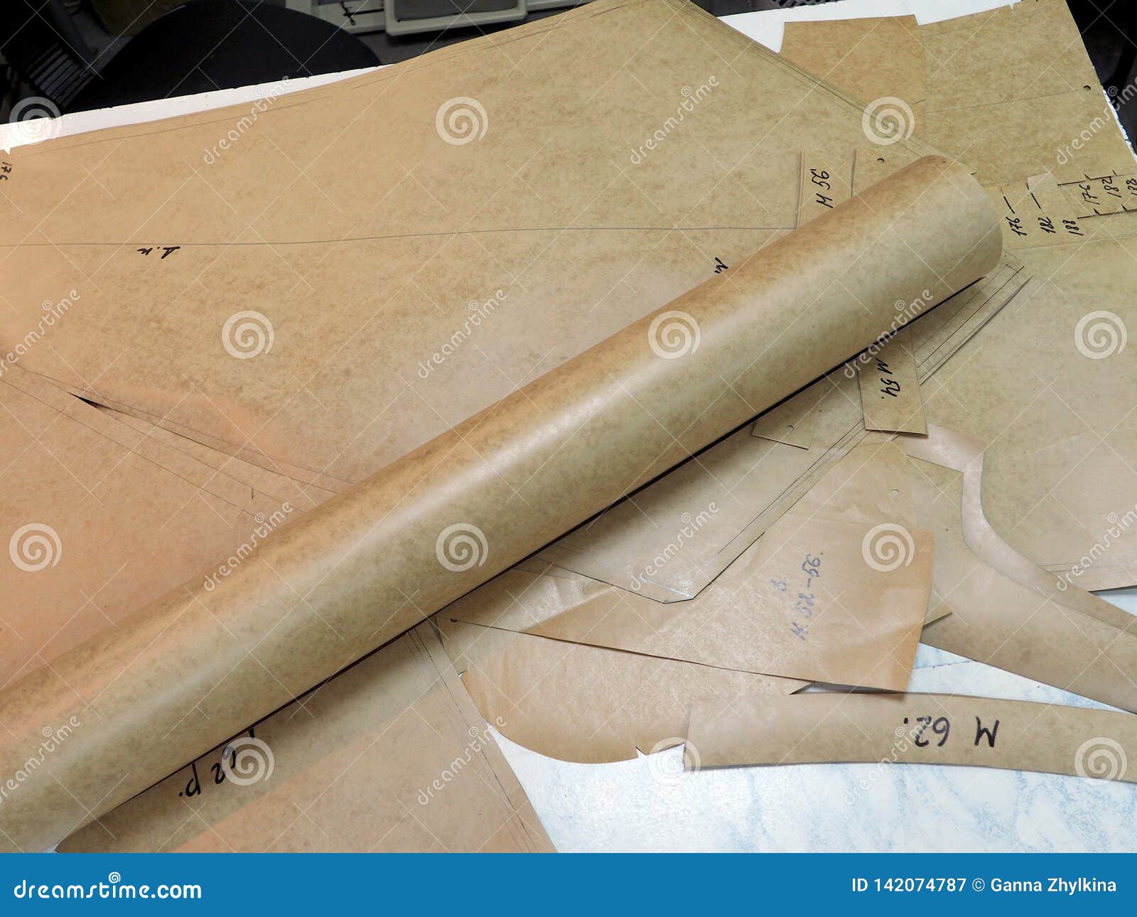 Roll of Drawing Paper and Patterns on the Table Stock Image - Image of ...